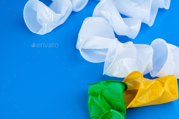 Disposable colored plastic cups garbage. Garbage and pollution concept ...