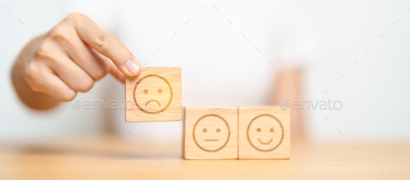 Hand choosing unhappy angry face from Emotion block Stock Photo by ...