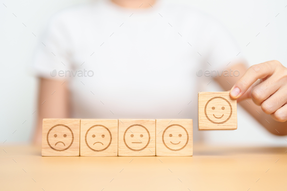 Hand choosing smile face from Emotion block for customer Stock Photo by ...