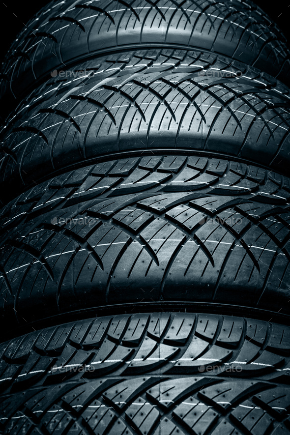 New tyres background. Car tyres close up Stock Photo by FabrikaPhoto