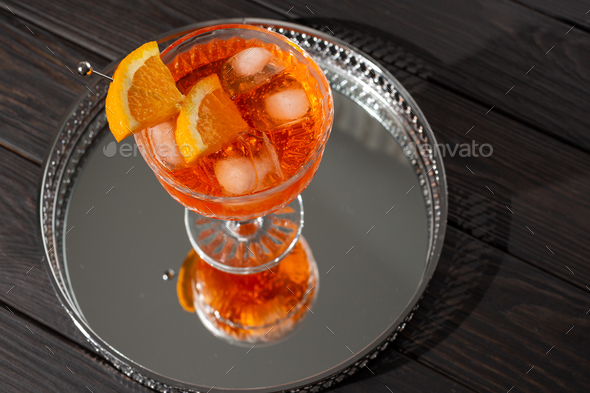 Cocktail Aperol Spritz in a flat glass on a mirrored tray Stock Photo ...