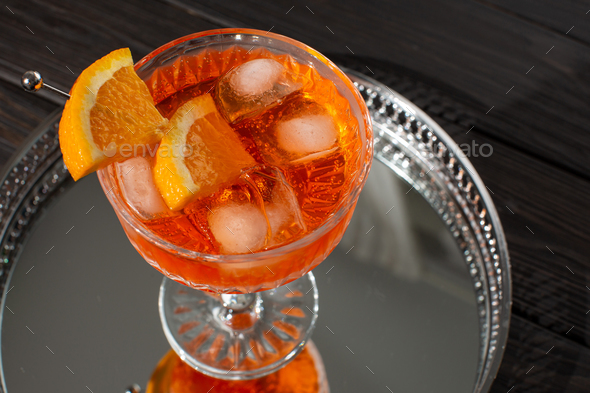 Cocktail Aperol Spritz in a flat glass on a mirrored tray Stock Photo ...