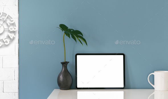 Mockup blank white screen tablet and decoration object on white top ...