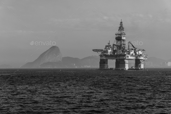 Grayscale of the oil platform in the ocean Stock Photo by wirestock