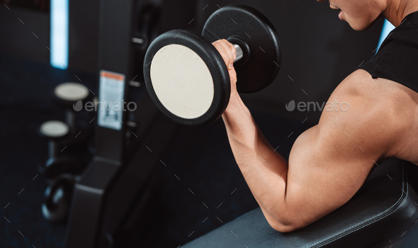 Male working out Bodybuilder with dumbbell weights at the gym. Stock ...