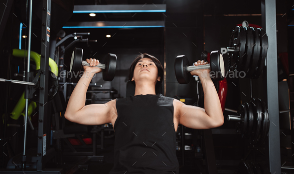 Male working out Bodybuilder with dumbbell weights at the gym.man ...