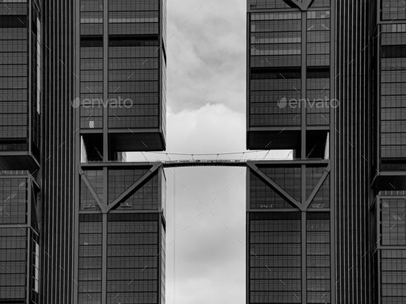 Grayscale of the bridge connecting the twin business towers Stock Photo ...