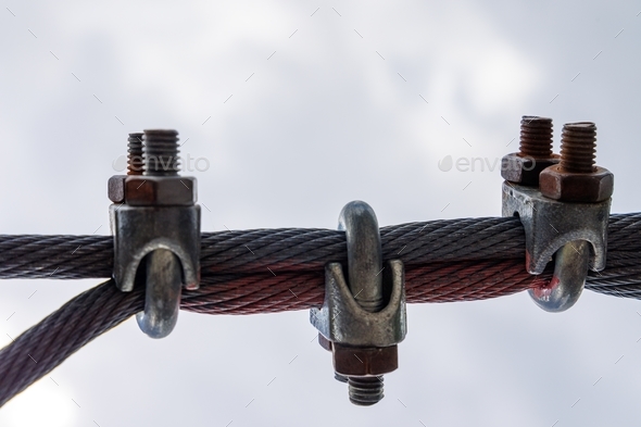 Cable with fastening with bolts and nuts of, outdoors Stock Photo by ...