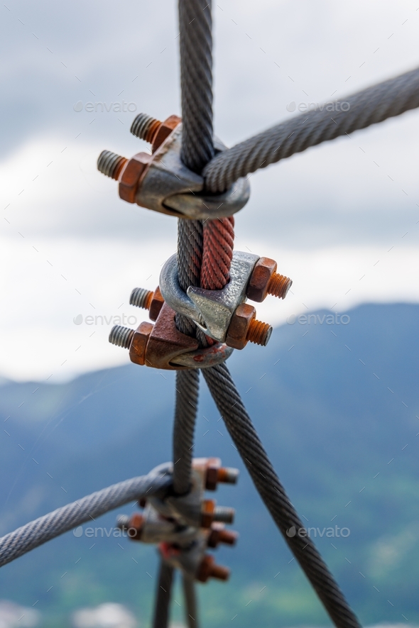 Cable with fastening with bolts and nuts of, outdoors Stock Photo by ...