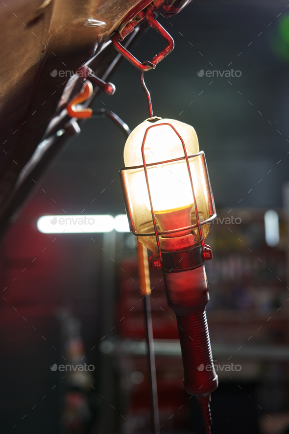 the light bulb in the carrying lamp shines with a bright light. The ...