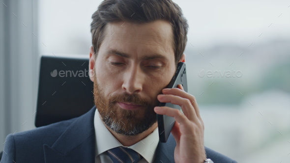 Exhausted boss calling phone sitting company office close up. Owner ...