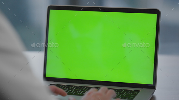 Woman typing mockup laptop on office desk closeup. Lady using chroma ...