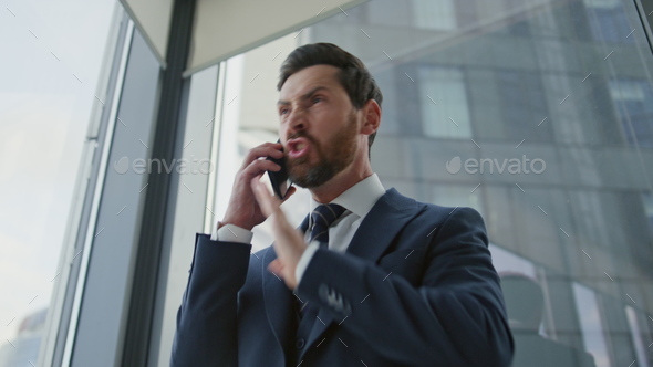 Angry boss shouting phone call close up. Furious businessman ending ...