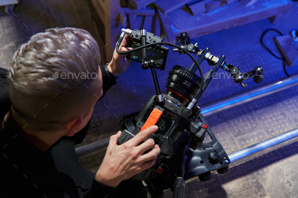 top view of a professional videographer who, on the set, shoots a movie ...