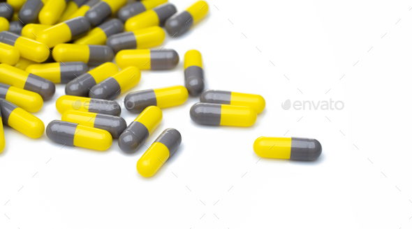 Yellow and gray probiotic capsule pill on white background. Probiotic ...