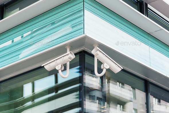 Two modern cctv security cameras on modern building facade Stock Photo ...