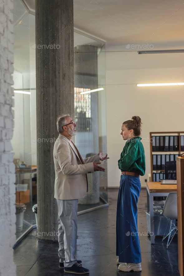 Disappointed boss ceo scolding young office worker, intern. Stock Photo ...