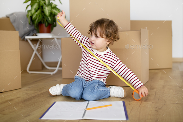 Future Interior Designer. Cute Little Boy Playing With Tape Ruler At ...