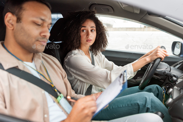 Driver Woman Failing Driving Test Looking At Instructor In Car Stock ...