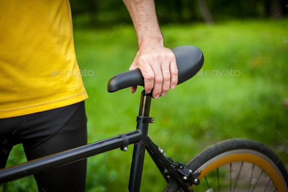 Cyclist with his bike, close up. Outdoor photography. Stock Photo by ...