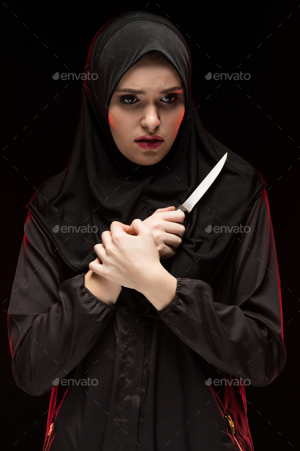 Portrait of beautiful desperate scared frightened young muslim woman ...
