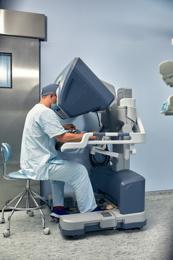 Hands of a surgeon at a computer robot. medical robot. Robotic Surgery ...