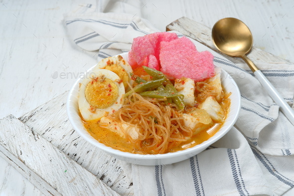 lontong sayur- Compressed rice cake served with curry coconut milk ...