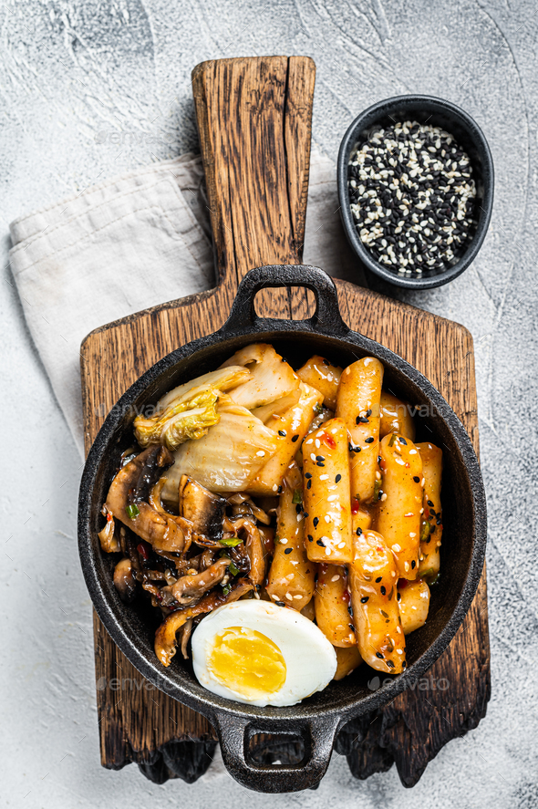 Tteokbokki, Topokki stick rice cake in spicy sauce with egg and ...