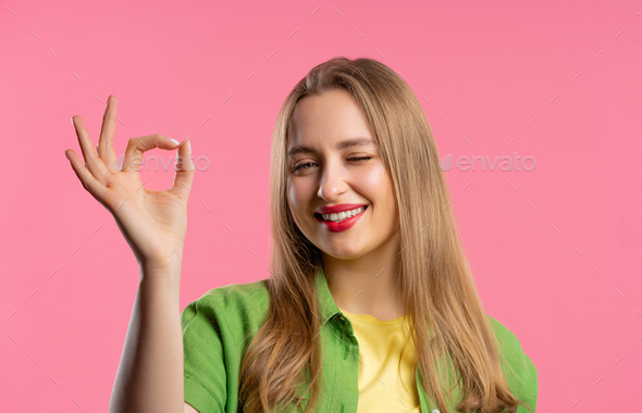 Pretty woman with OKAY sign, ok gesture. Happy lady, correct choice on ...
