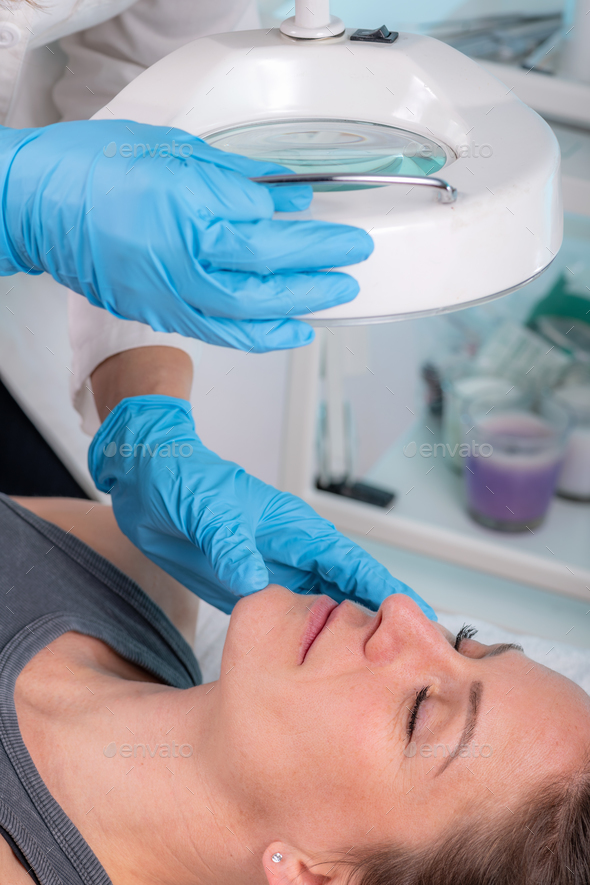 Unveiling Dermatological Changes on Patient’s Skin Stock Photo by microgen