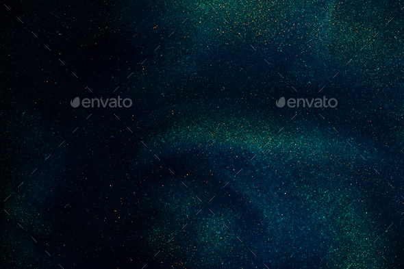 Floating Magic Gold Particles In Blue Fluid. Stock Photo by nikonlamp