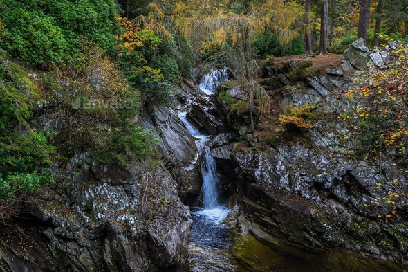 Landscape of Falls of Bruar Waterfall with mossy rocks in Scotland ...