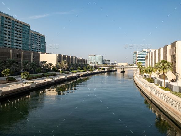 The canal and buildings in the Al Raha Beach neighbourhood Stock Photo ...