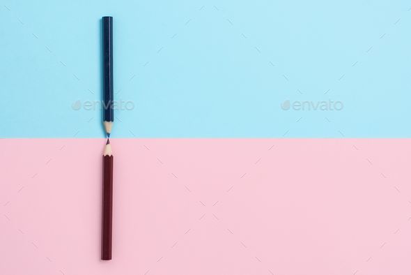 Two Objects Arranged Facing Inward Outward On a Separated Coloured ...