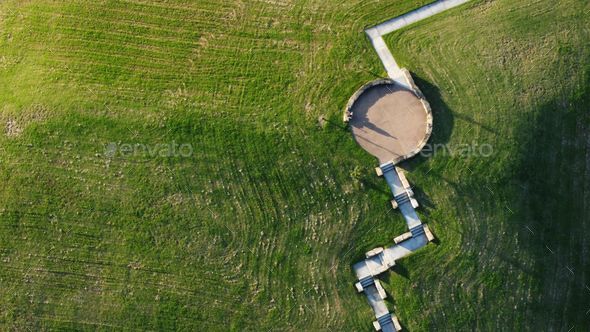 Aerial view of the green lawn with a circular pathway. Stock Photo by ...