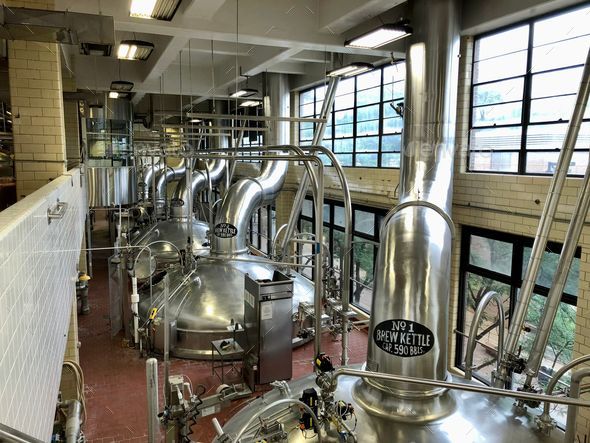 Inside of a beer factory with metallic brew kettle stations Stock Photo ...