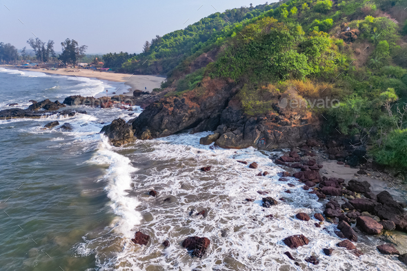 Aerial top view on tropical beach with green palm trees under sunlight ...
