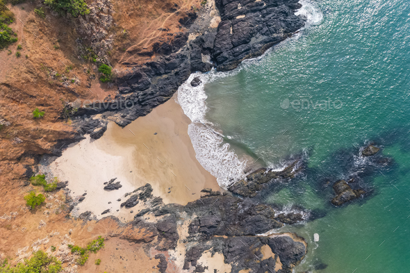 Aerial top view on tropical beach with green palm trees under sunlight ...
