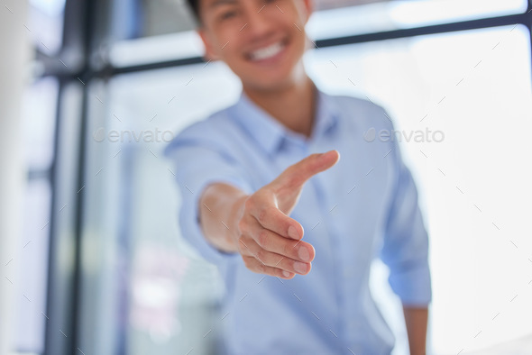 Closeup of one business man extending hand forward to greet and welcome ...