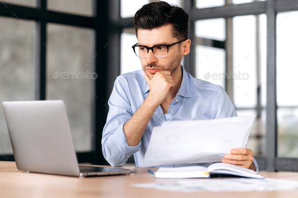 Successful smart focused caucasian business man thinking over business ...