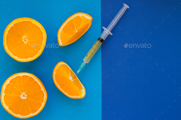 syringe is ready for mesotherapy injection. Orange in a Cut and Syringe ...