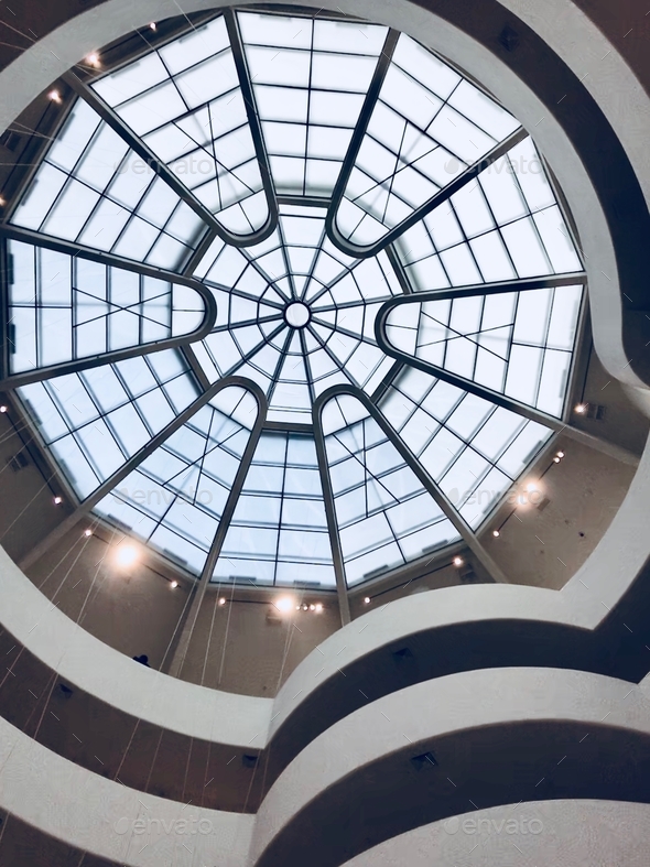 Vertical low angle shot of the circular glass ceiling in a modern ...
