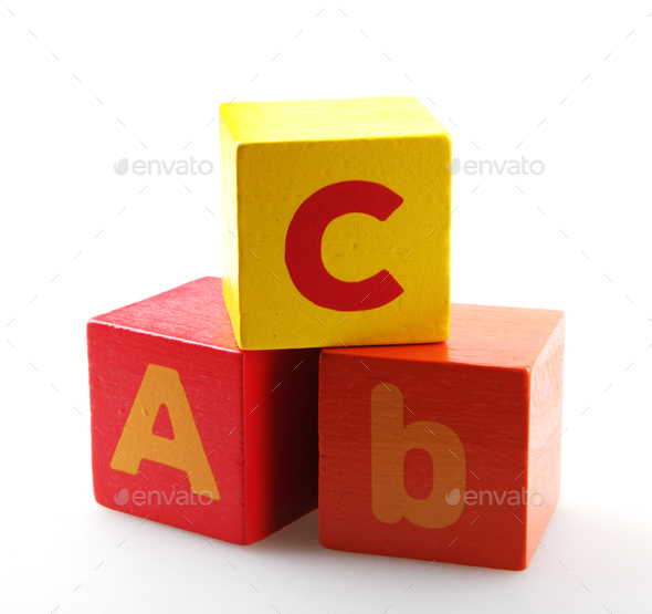Red and yellow alphabet wooden blocks isolated on the white background ...