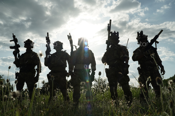 Soldier in full US MARSOC armed with assault rifle run through the ...