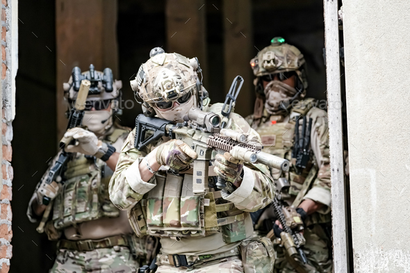 Soldier in full US MARSOC armed with assault rifle run through the ...