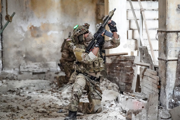 Soldier in full US MARSOC armed with assault rifle run through the ...