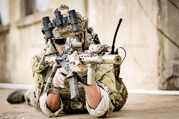 Soldier in full US MARSOC armed with assault rifle run through the ...