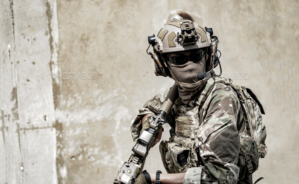 Soldier in full US MARSOC armed with assault rifle run through the ...