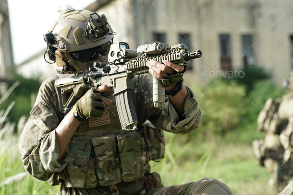 Soldier in full US MARSOC armed with assault rifle run through the ...