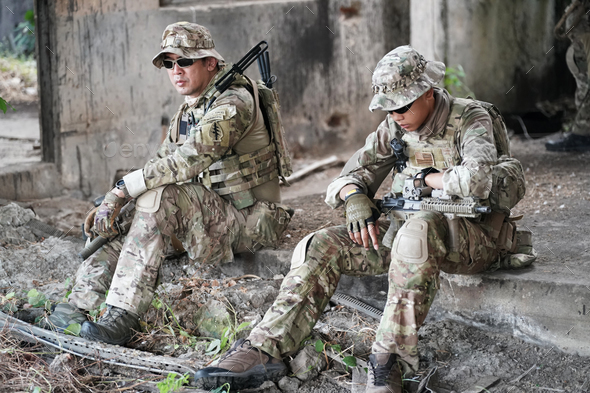 Soldier in full US MARSOC armed with assault rifle run through the ...